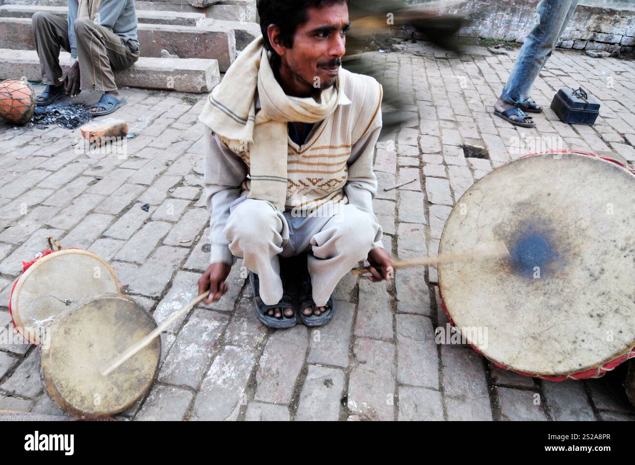 Percussion players playing by a Hindu temple in Ayodhya, Uttar Pradesh ...