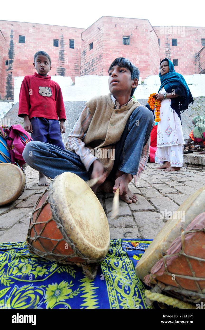 Percussion players playing by a Hindu temple in Ayodhya, Uttar Pradesh ...