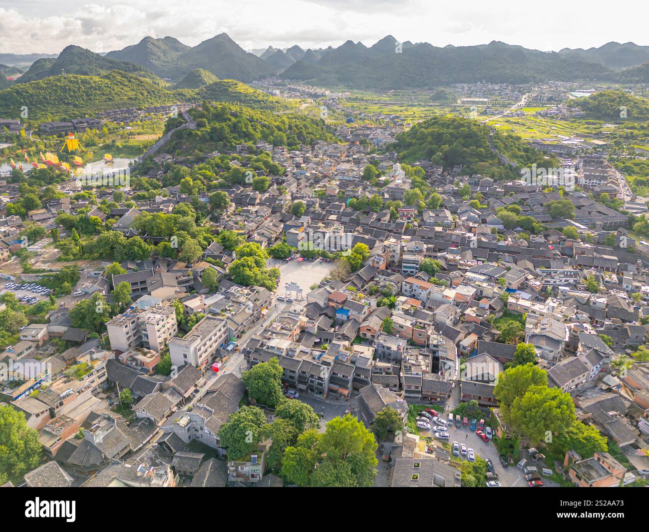Aerial of the Qingyan Ancient Town and surrounding limestone hills ...