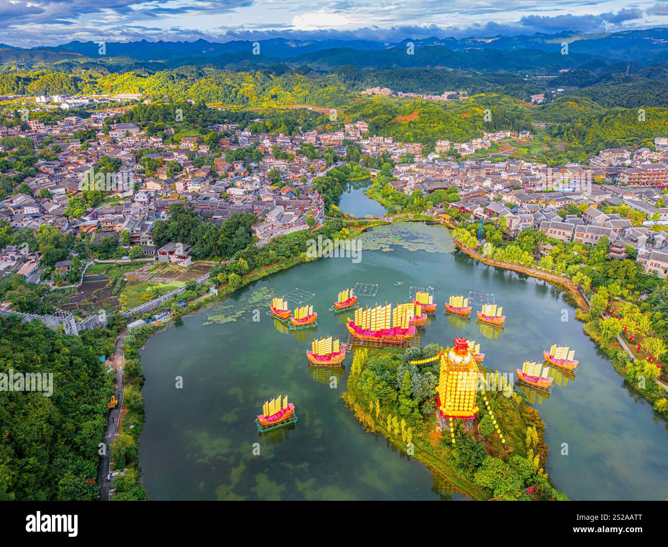 The pond with ships and streets of Qingyan Ancient Town, one of the top ...