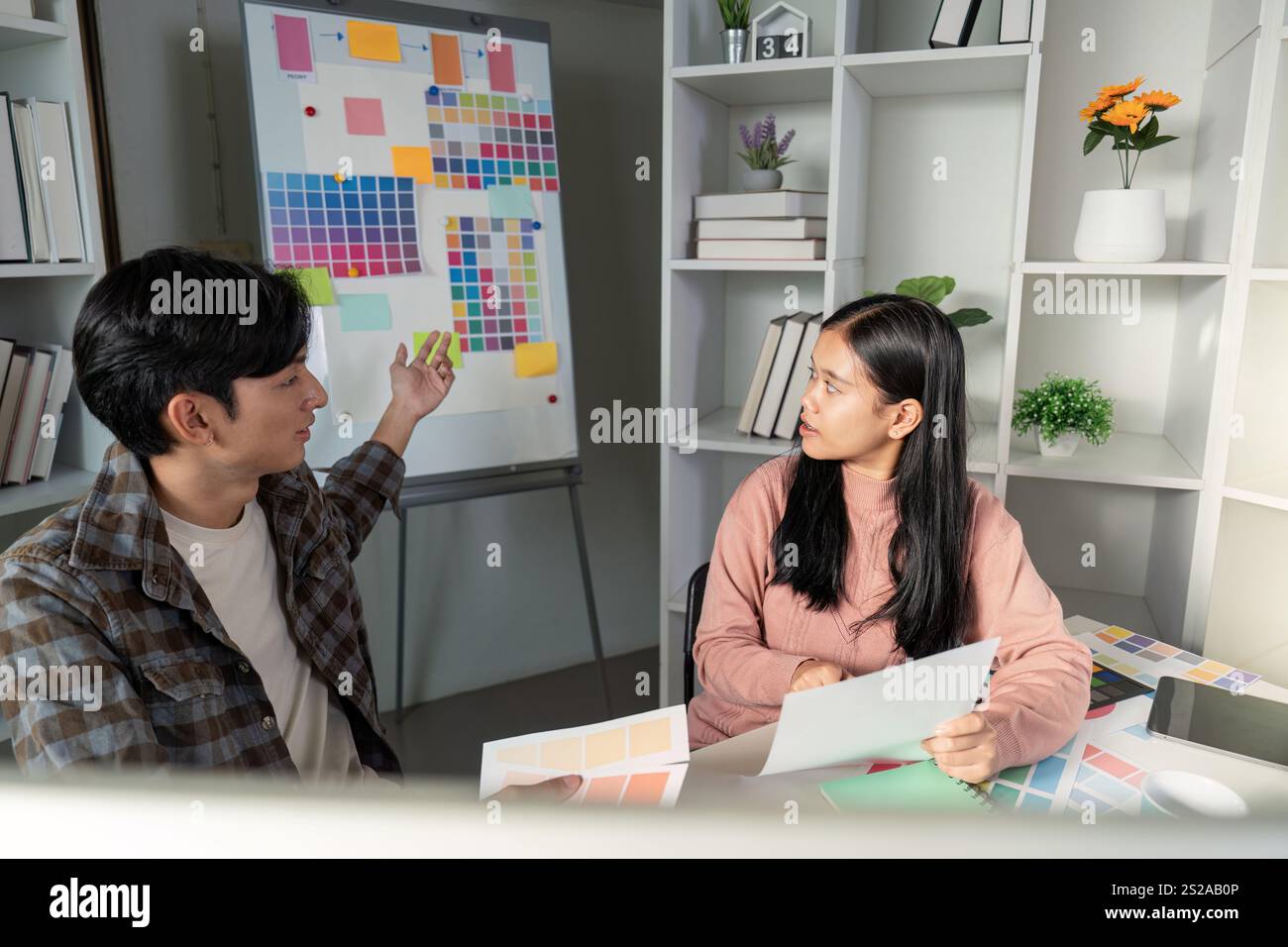 Creative team designs graphics during strategic meeting office ...