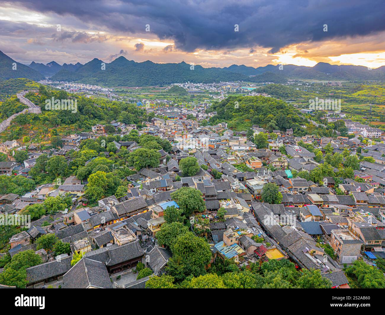 Cloudy sunset above Qingyan Ancient Town, one of the top 4th famous old ...