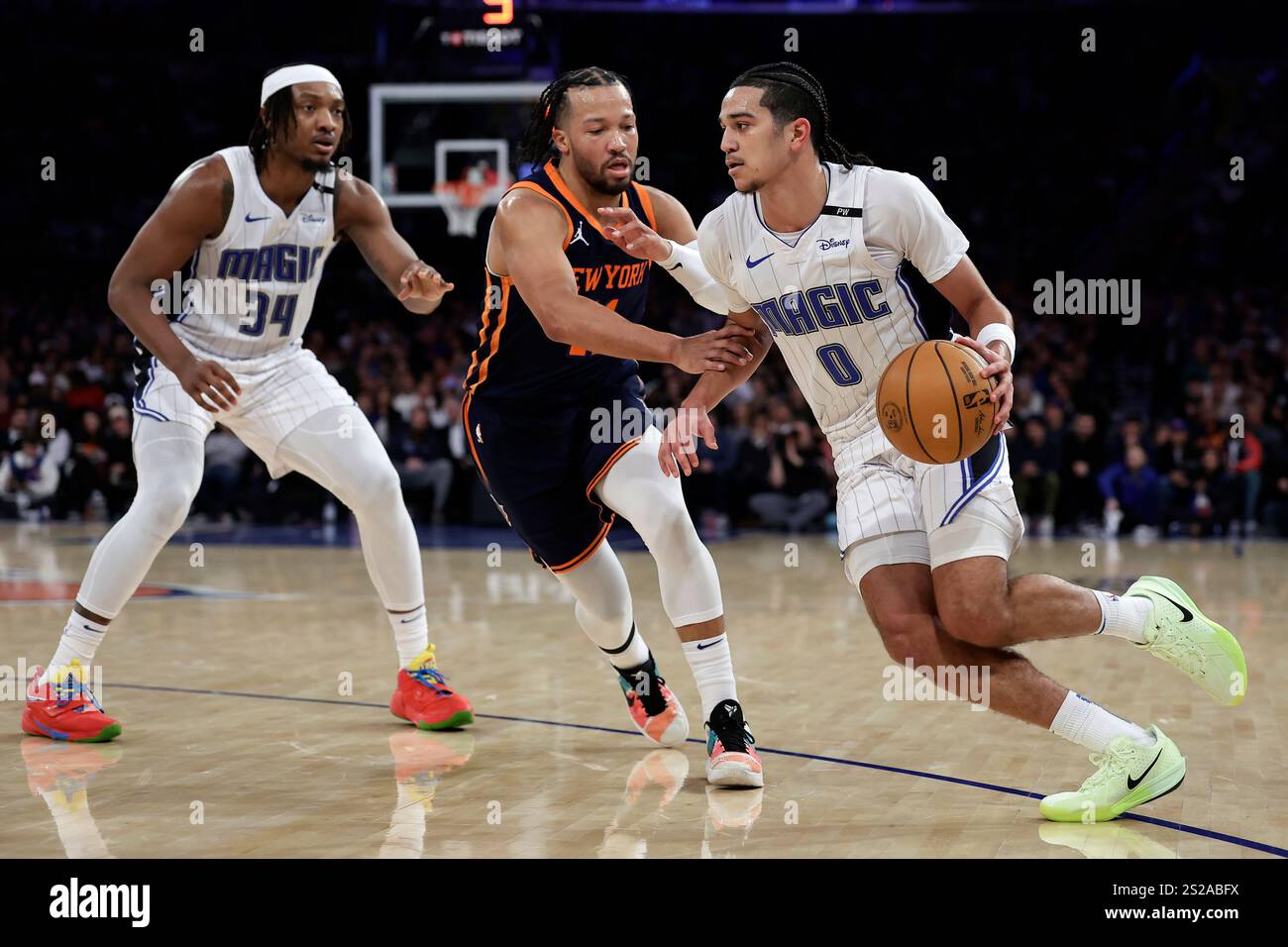Orlando Magic guard Anthony Black (0) drives past New York Knicks guard ...
