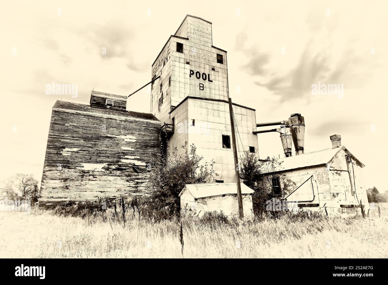 A grain silo with the word ROOM on it. The silo is old and abandoned ...