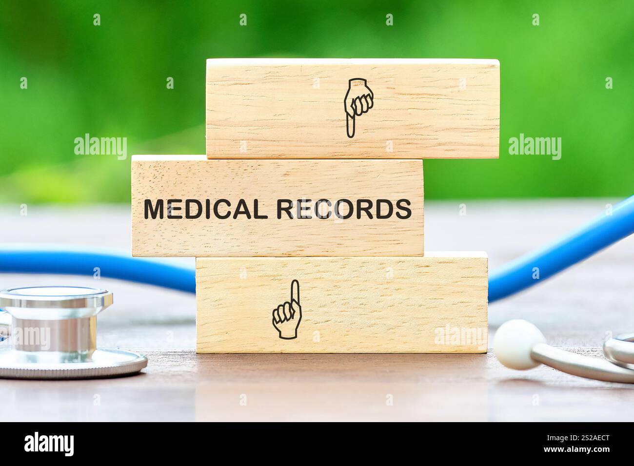 Wooden blocks display the term medical records alongside health symbols ...