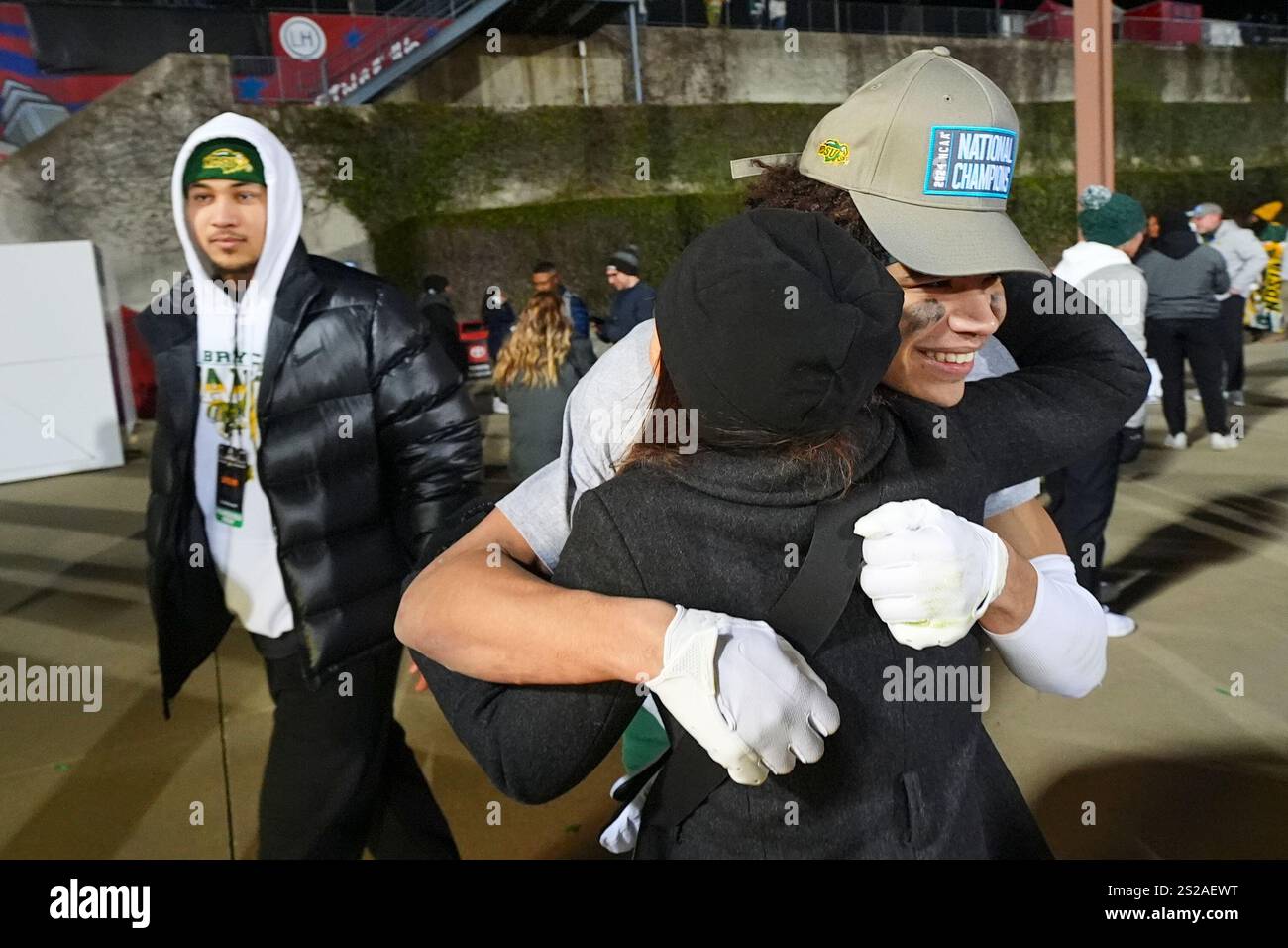 North Dakota State wide receiver Bryce Lance, right, hugs a supporter ...
