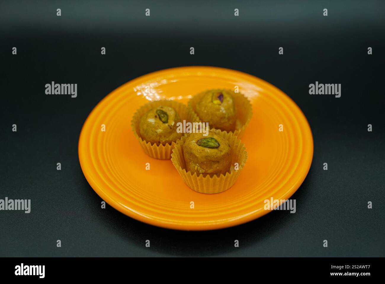 Delicious Indian Laddus with Pistachio Garnish Stock Photo - Alamy