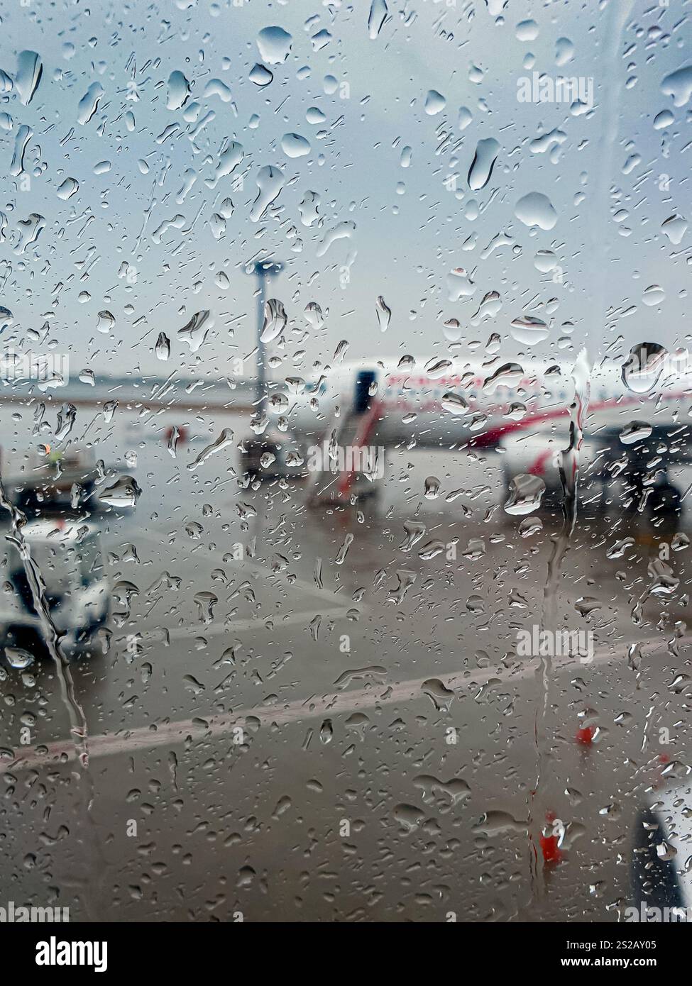 Closeup photo of rain water droplets on the airplane porthole Stock ...