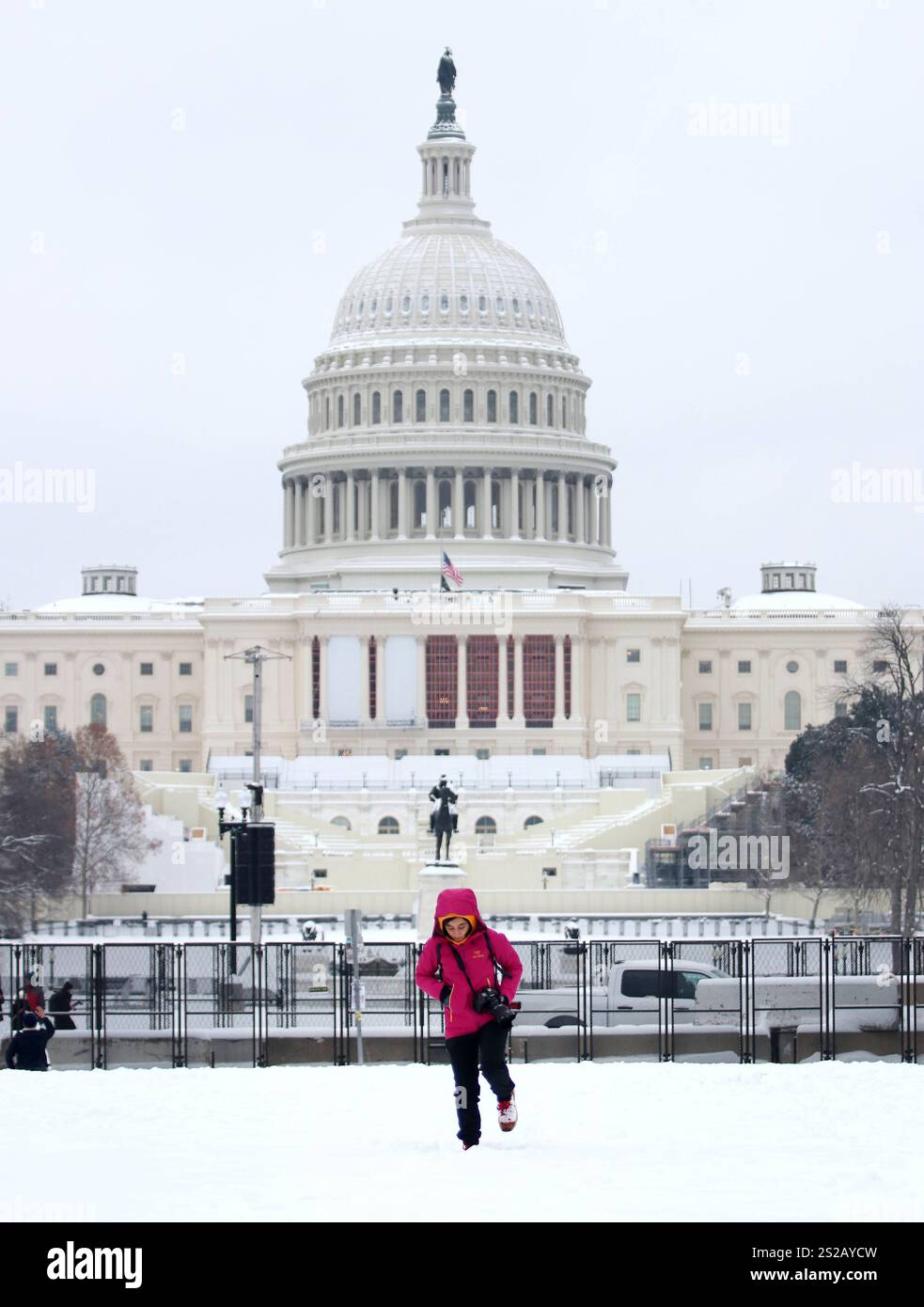 Winter storm state of emergency in Washington DC, USA A woman walks in ...