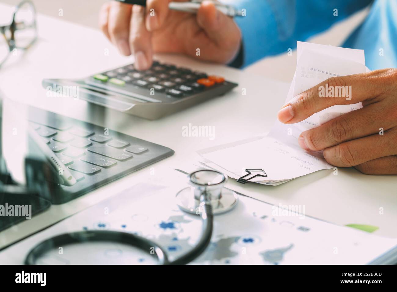 Healthcare costs and fees concept.Hand of smart doctor used a ...