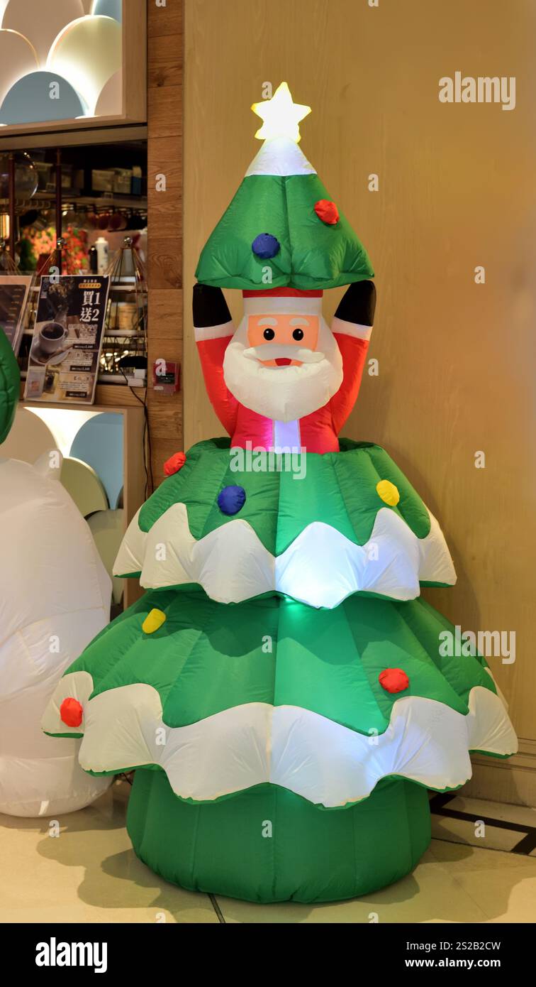 Santa Claus inside a Christmas tree Stock Photo - Alamy