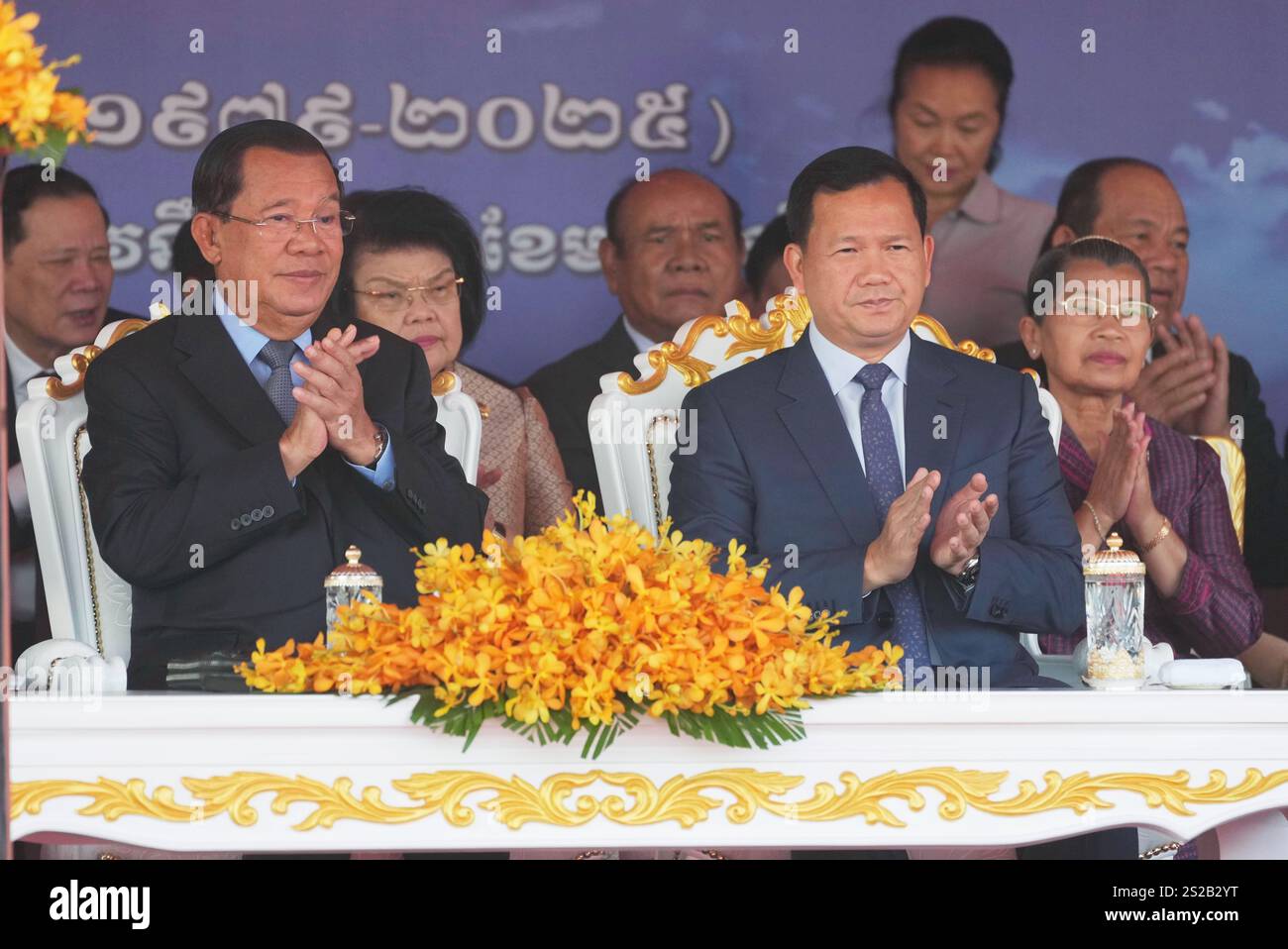 Cambodian President of the Senate Hun Sen, front left, sits together ...