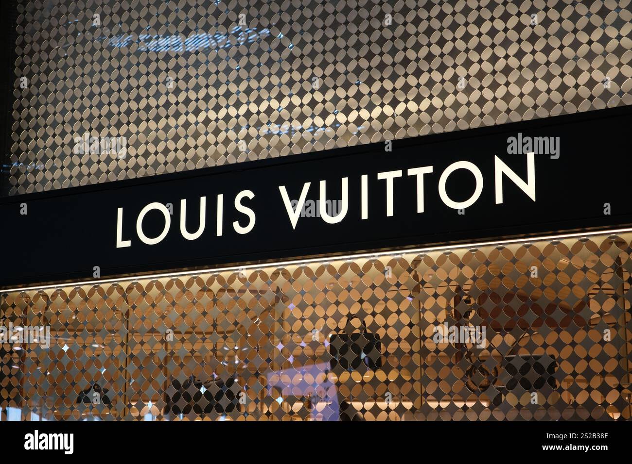 LOUIS VUITTON brand logo store sign Stock Photo - Alamy