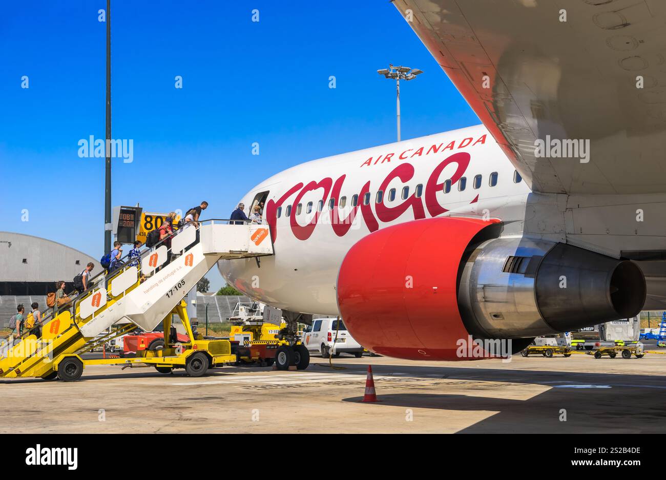 Lisbon, Portugal, September 13, 2018: Passengers boarding Rouge Air ...