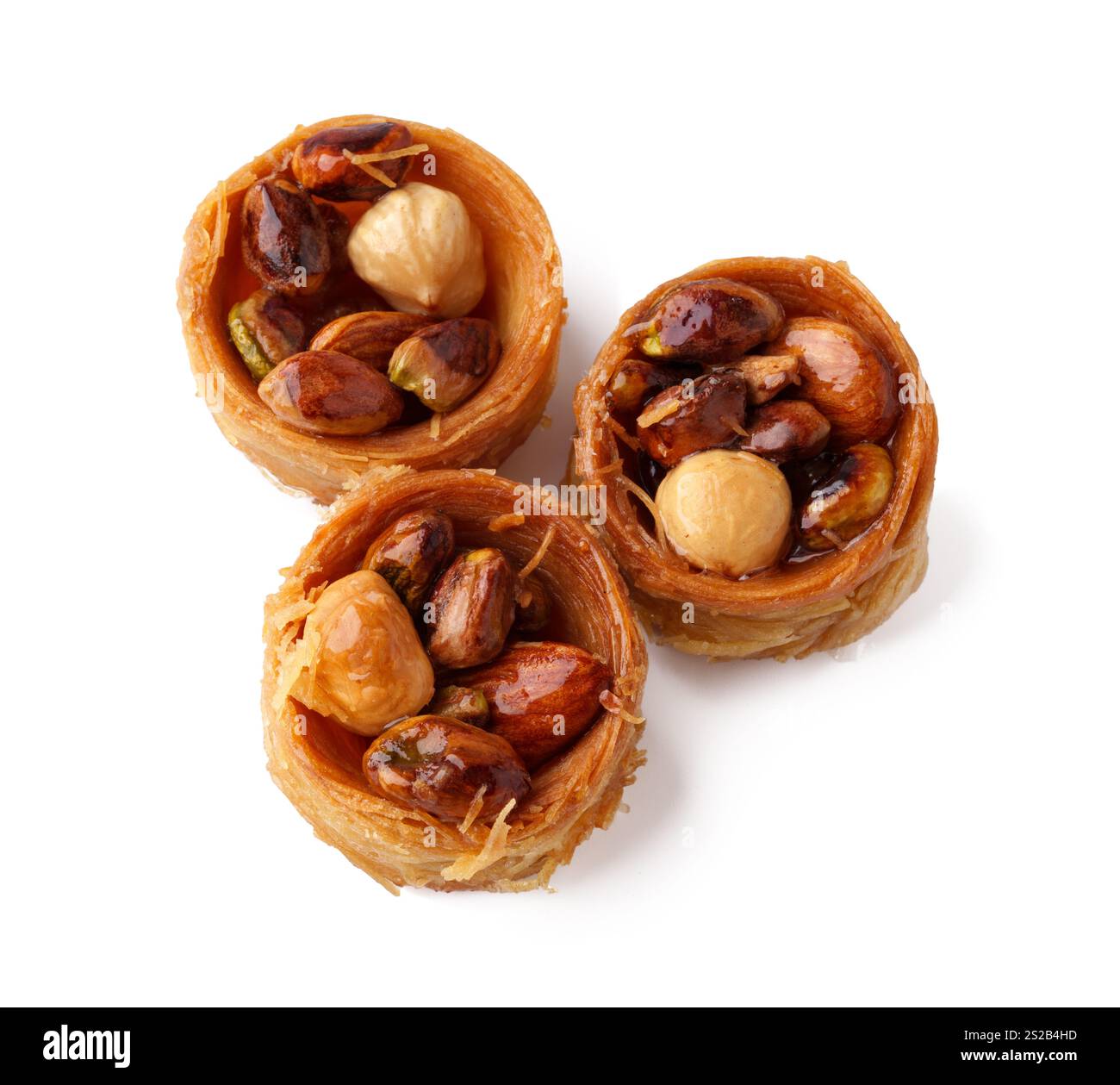 Delicious pastry filled with mixed nuts and honey syrup showcases a ...