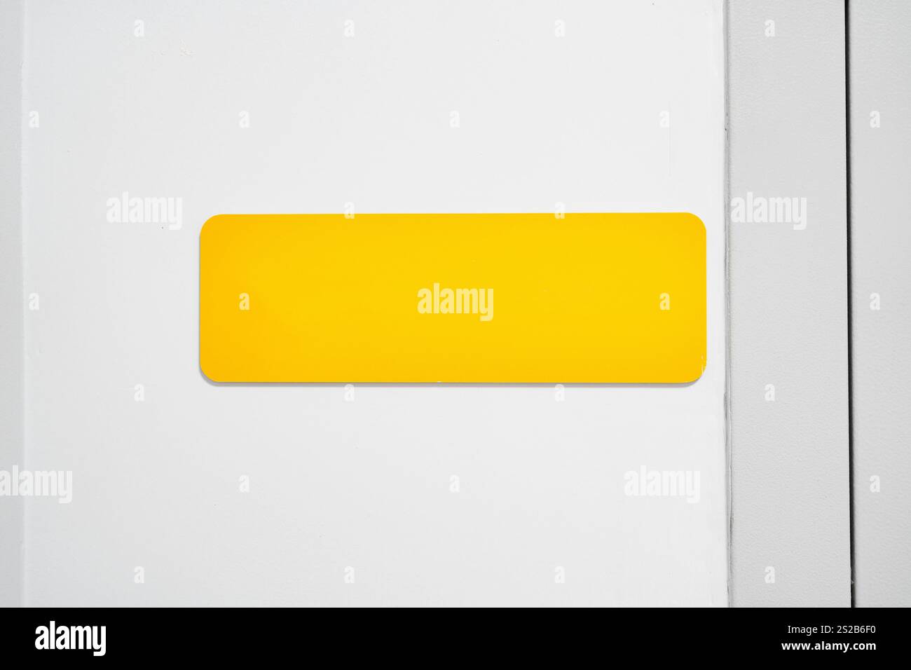 Bright yellow rectangular label on a plain white background perfect for ...