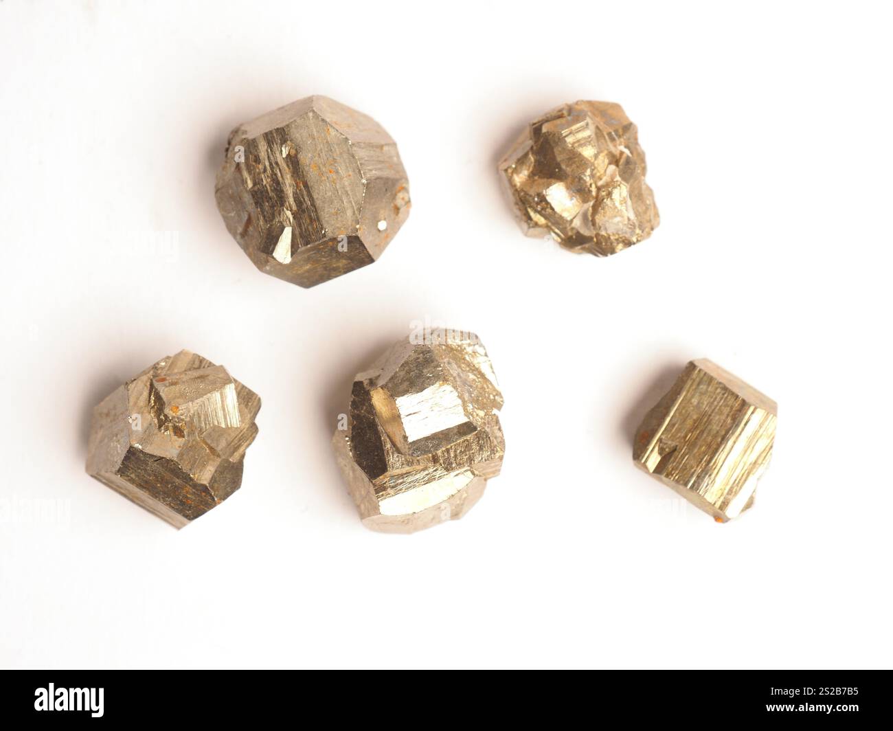 Small pyrite healing stones on a white background, alternative healing ...