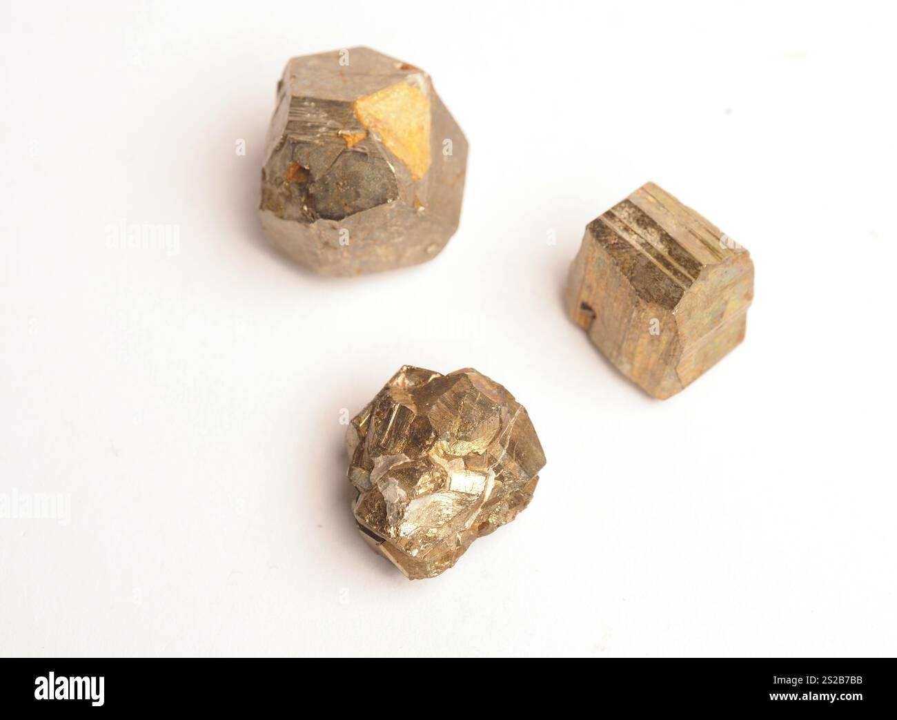 Small pyrite healing stones on a white background, alternative healing ...