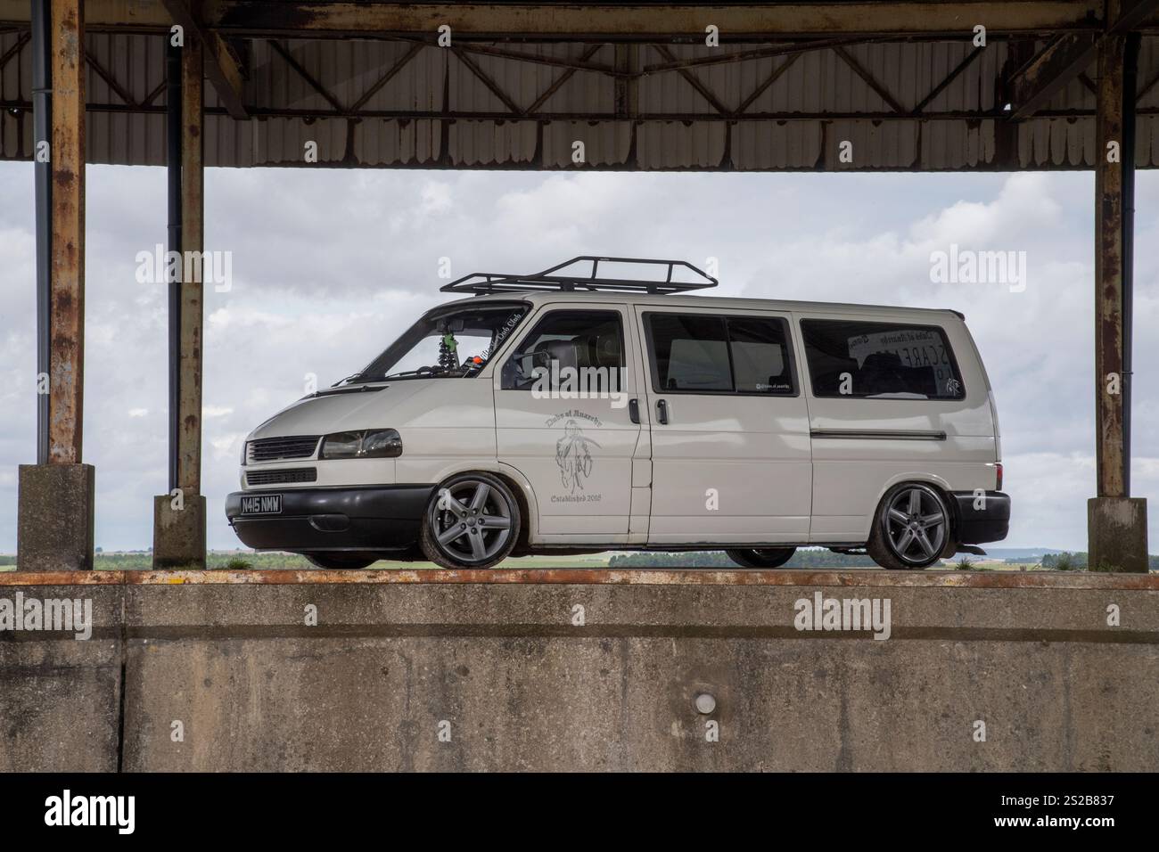 Slammed VW T4 camper van and modified classic VW Beetle Stock Photo - Alamy