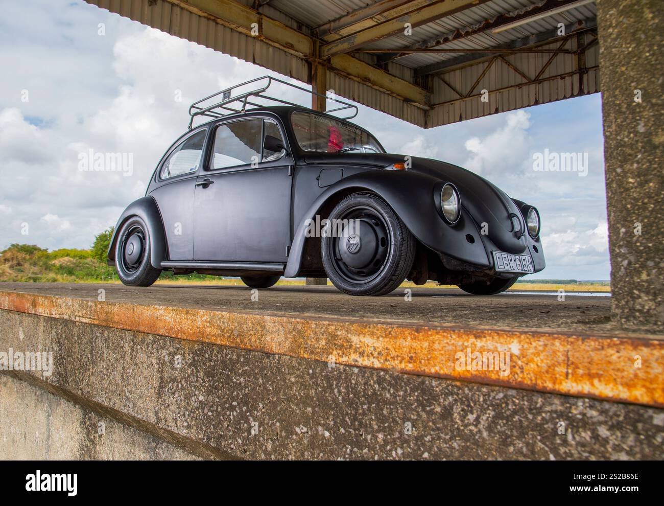 Slammed VW T4 camper van and modified classic VW Beetle Stock Photo - Alamy