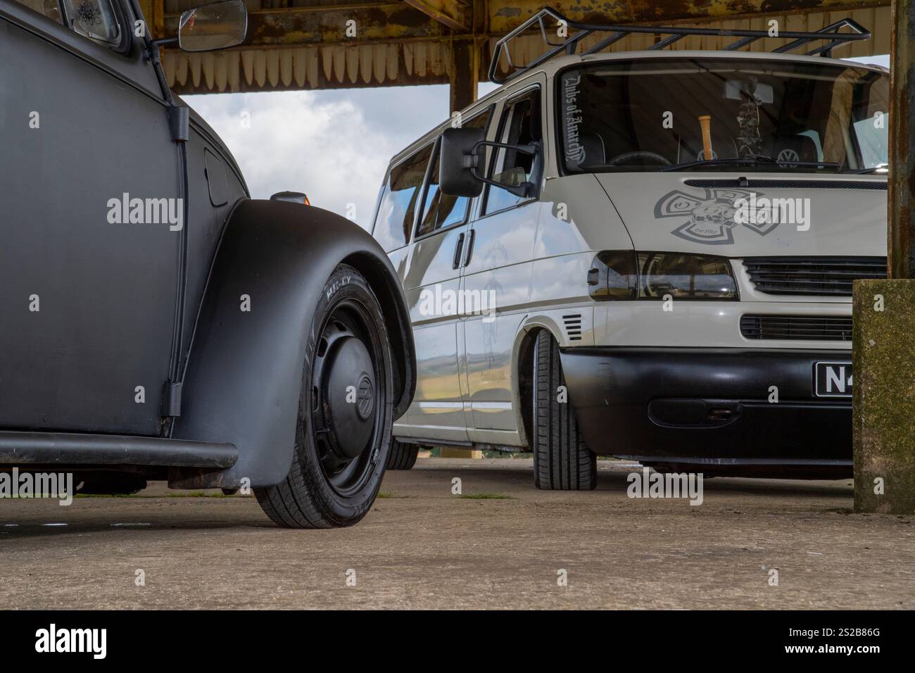 Slammed VW T4 camper van and modified classic VW Beetle Stock Photo - Alamy