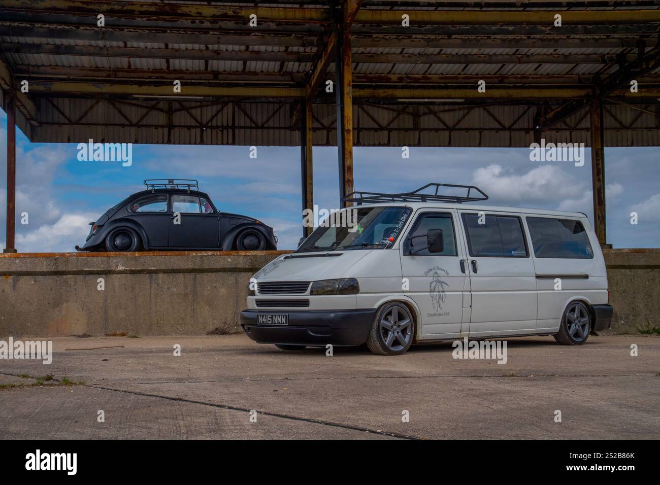 Slammed VW T4 camper van and modified classic VW Beetle Stock Photo - Alamy