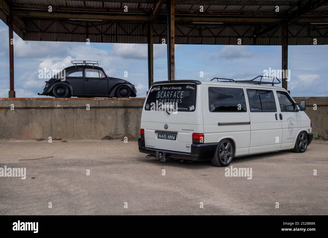 Slammed VW T4 camper van and modified classic VW Beetle Stock Photo - Alamy