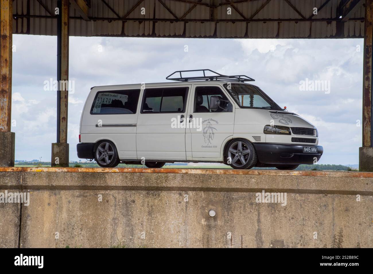 Slammed VW T4 camper van and modified classic VW Beetle Stock Photo - Alamy