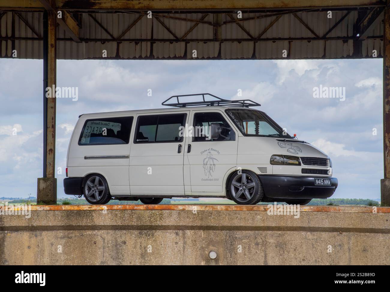 Slammed VW T4 camper van and modified classic VW Beetle Stock Photo - Alamy