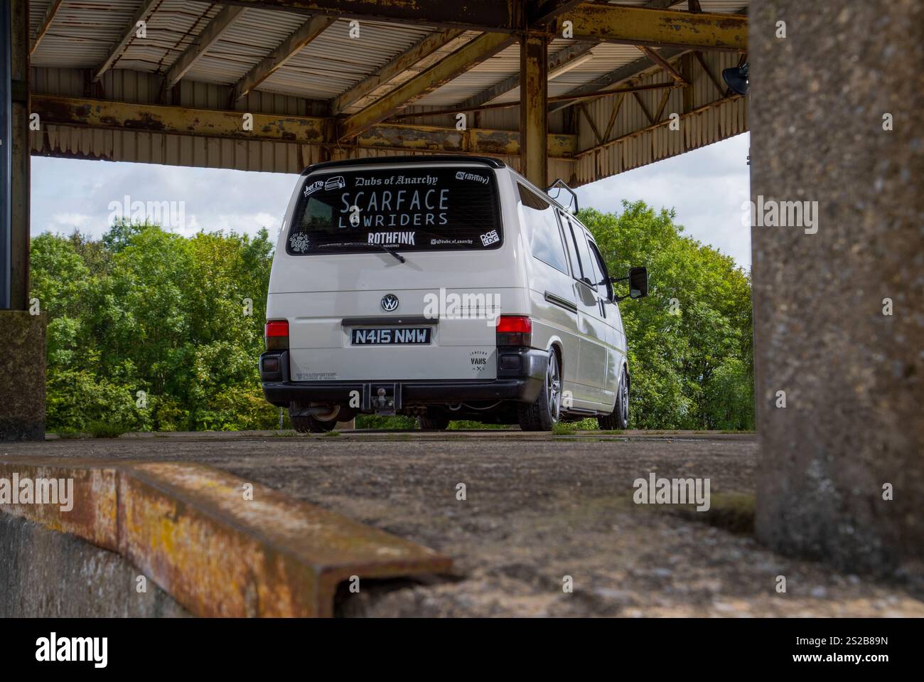 Slammed VW T4 camper van and modified classic VW Beetle Stock Photo - Alamy