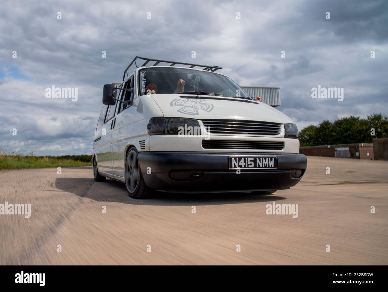 Slammed VW T4 camper van and modified classic VW Beetle Stock Photo - Alamy