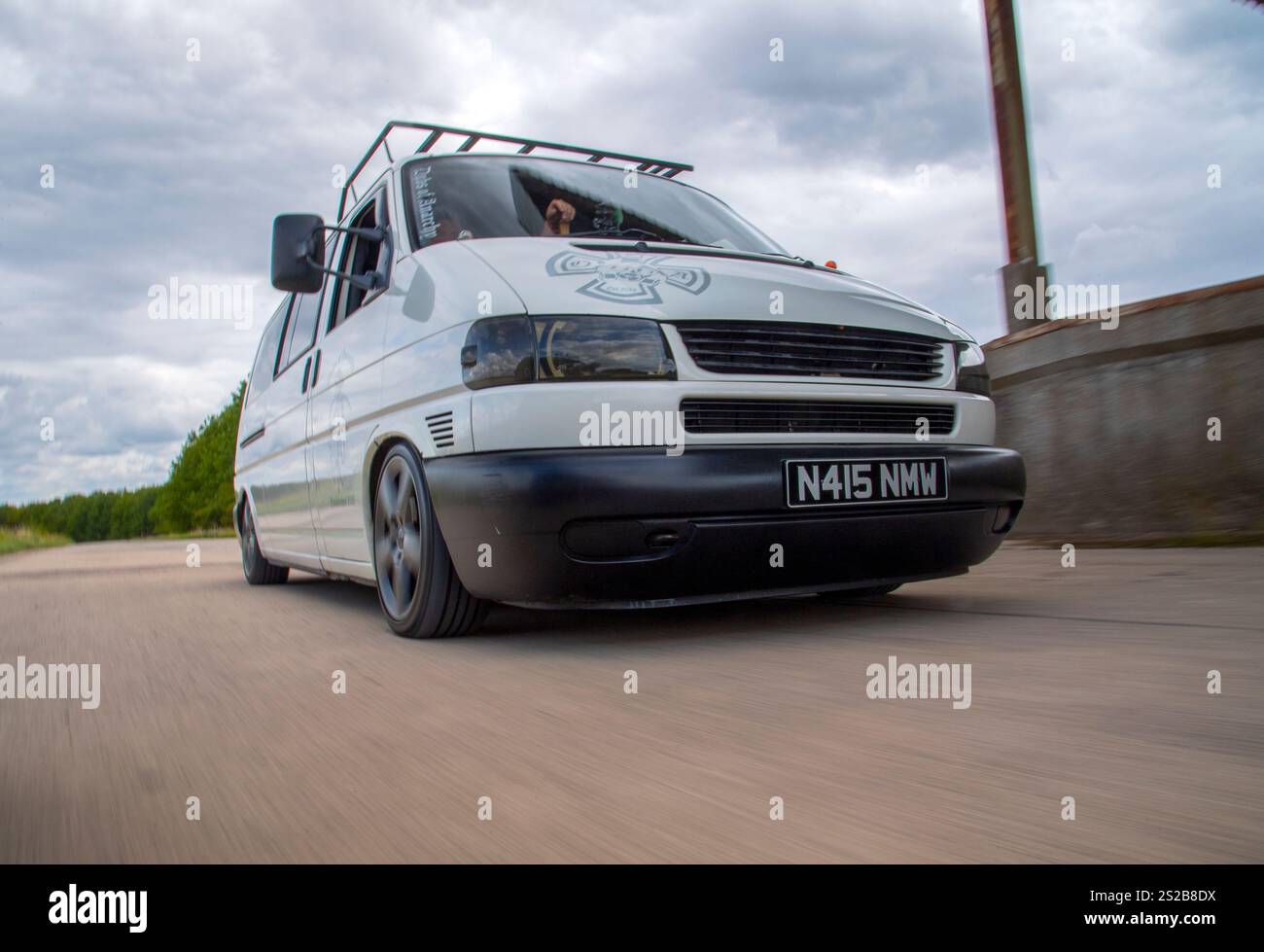Slammed VW T4 camper van and modified classic VW Beetle Stock Photo - Alamy
