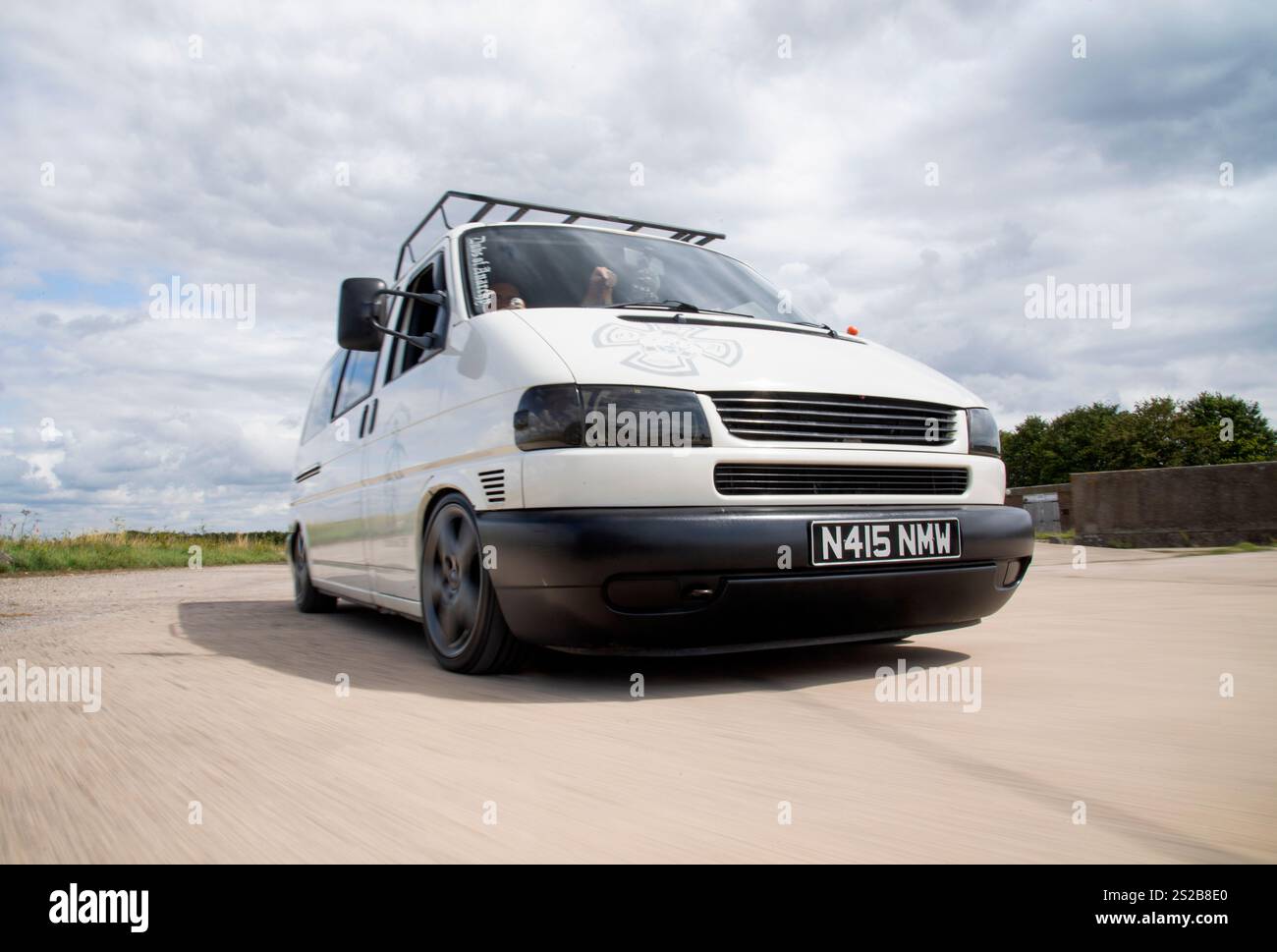 Slammed VW T4 camper van and modified classic VW Beetle Stock Photo - Alamy