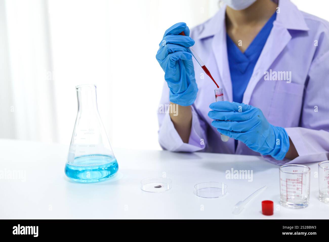 Scientist holding Coronavirus covid-19 infected blood sample tube. DNA ...