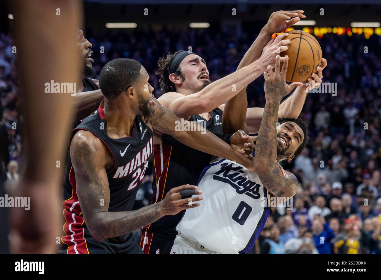 Sacramento Kings guard Malik Monk (0) fights for a rebound with Miami ...
