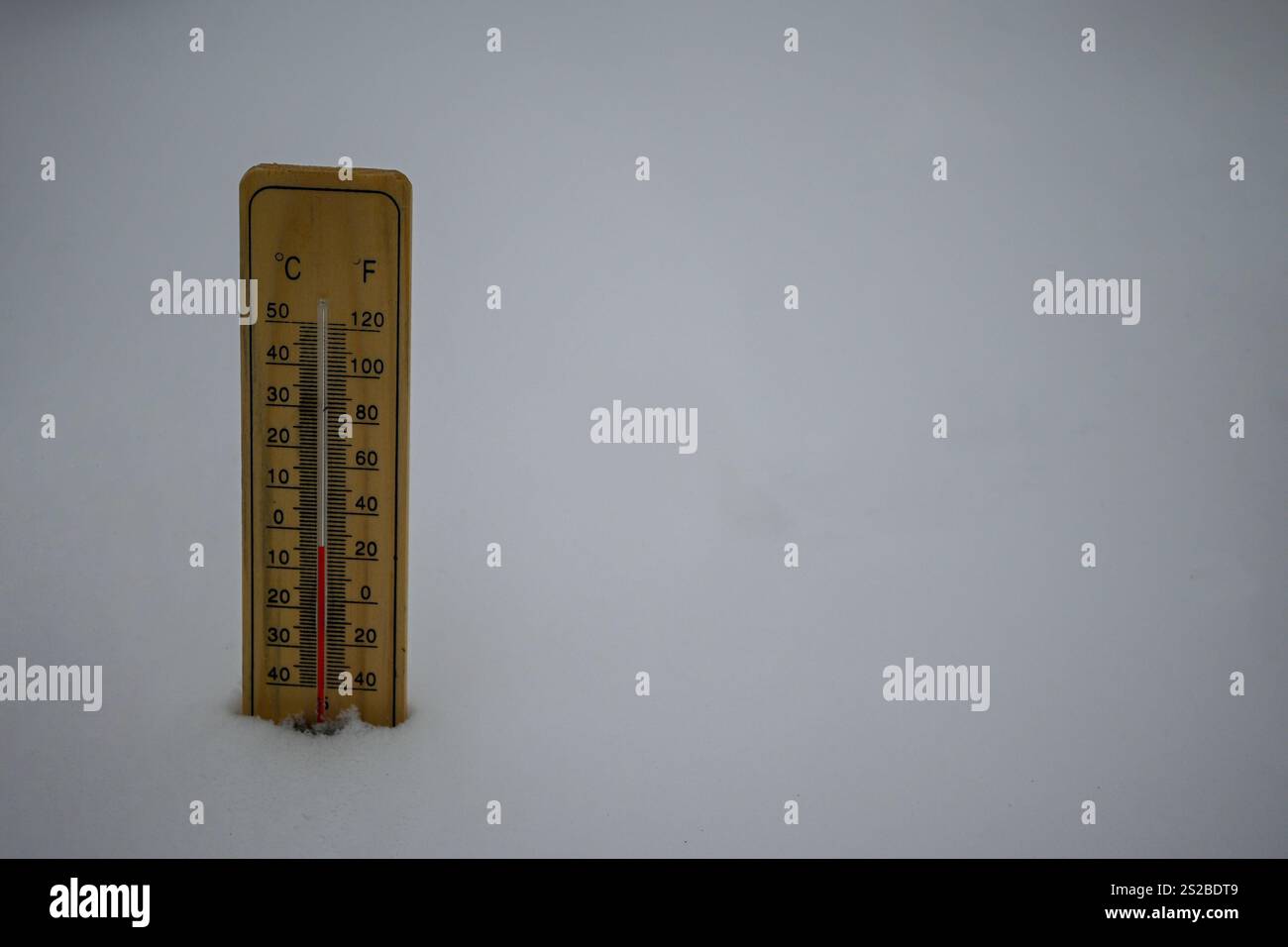 Wooden thermometer measuring freezing temperatures in celsius and ...