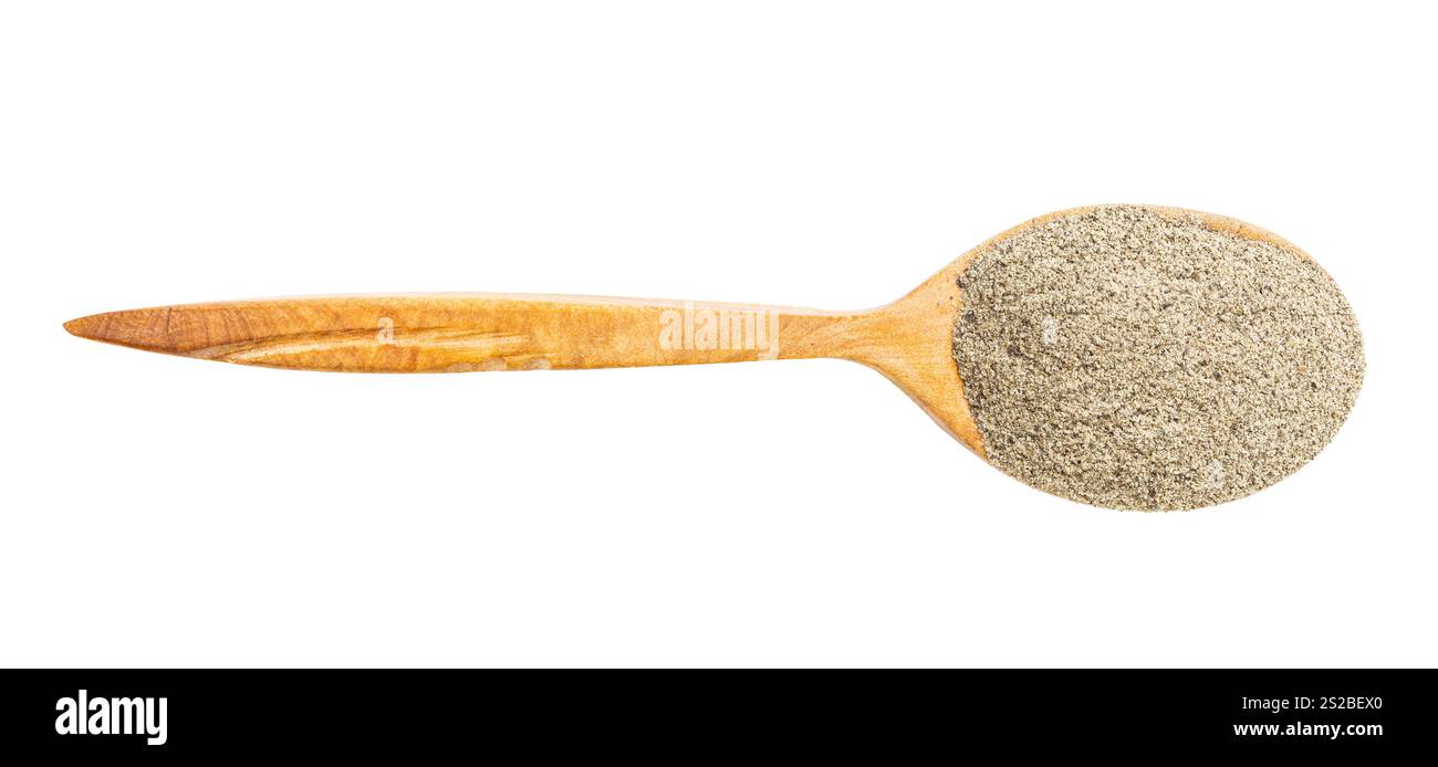 top view of wood spoon with ground black pepper isolated on white ...