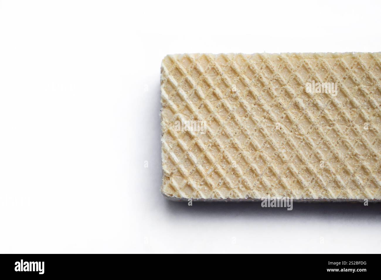 Close-up of a crispy waffle texture, showcasing its golden, grid-like ...