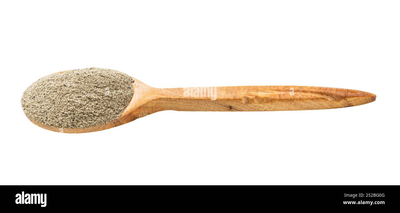 wooden spoon with ground black pepper isolated on white background ...