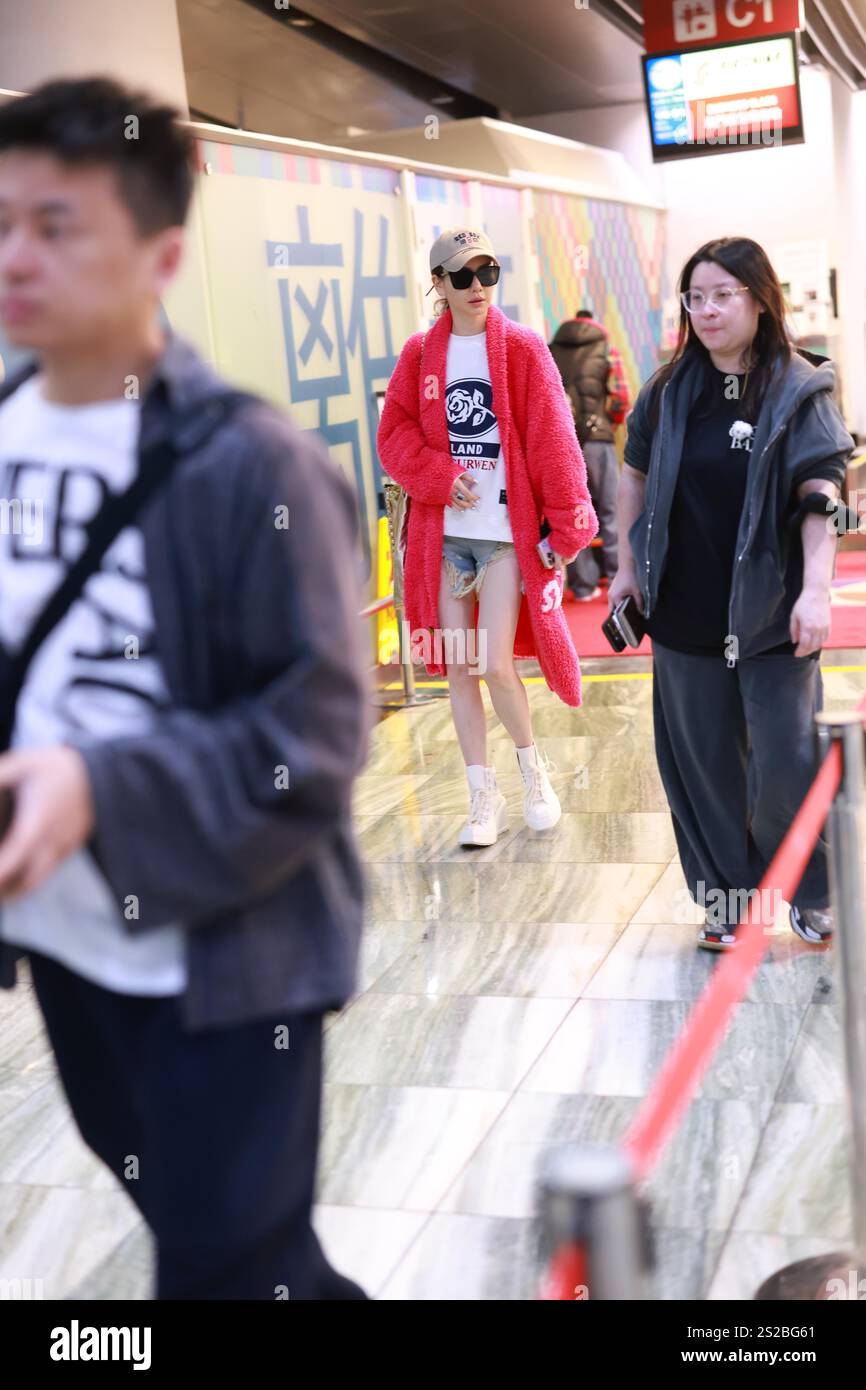 Chinese singer and actress Stephy Qi appears at the airport in Shanghai ...