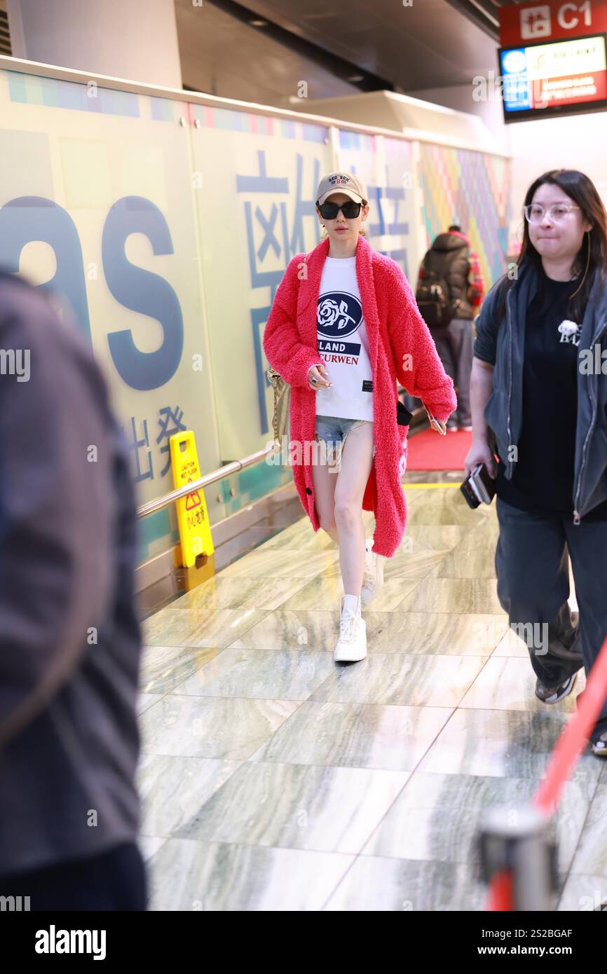 Chinese singer and actress Stephy Qi appears at the airport in Shanghai ...