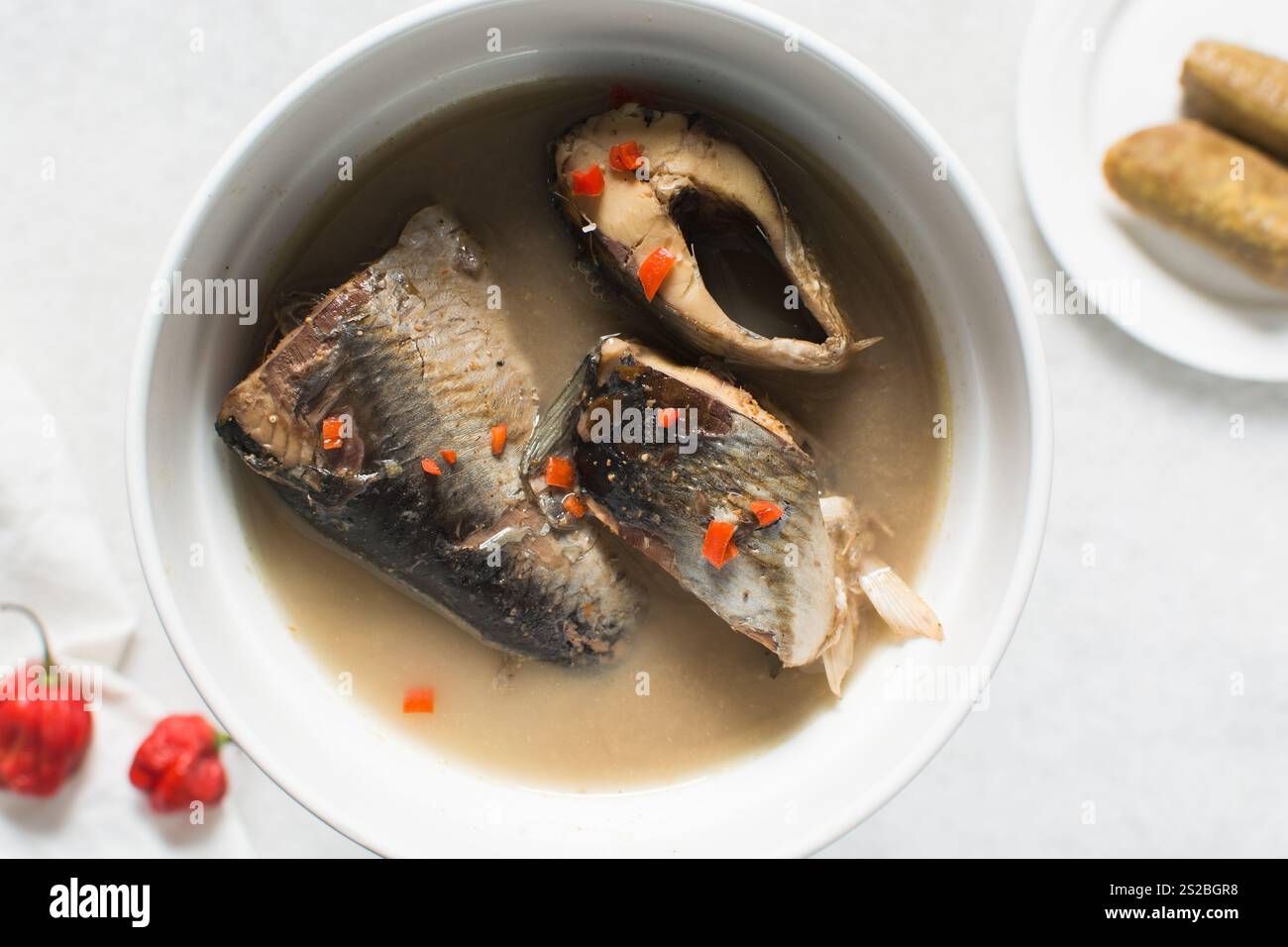 Overhead view of Nigerian pepper soup with fish, top view of fish ...