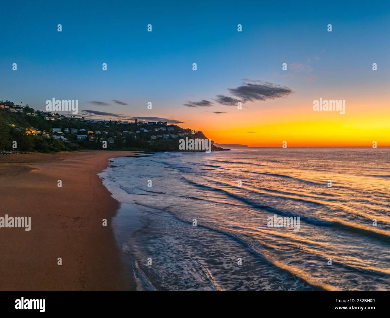 Aerial sunrise over Whale Beach in the Northern Beaches region of ...