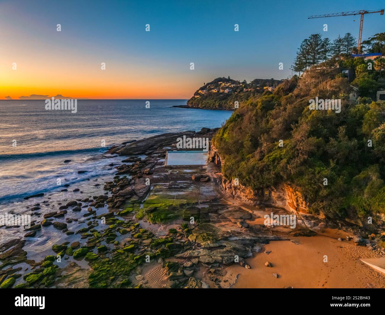 Aerial sunrise over Whale Beach in the Northern Beaches region of ...