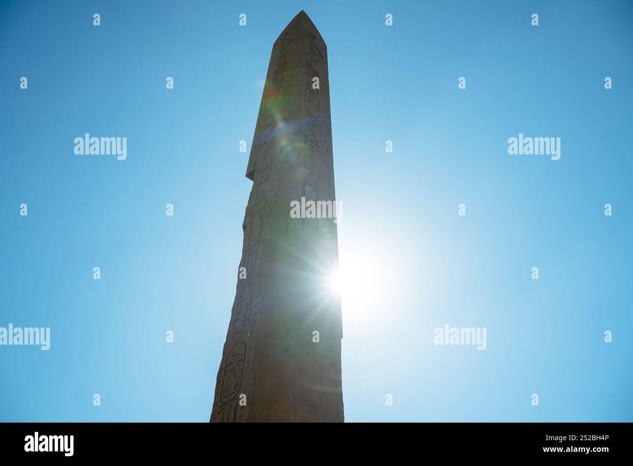 Ancient Egyptian Obelisk with a Ray of Sun Stock Photo - Alamy