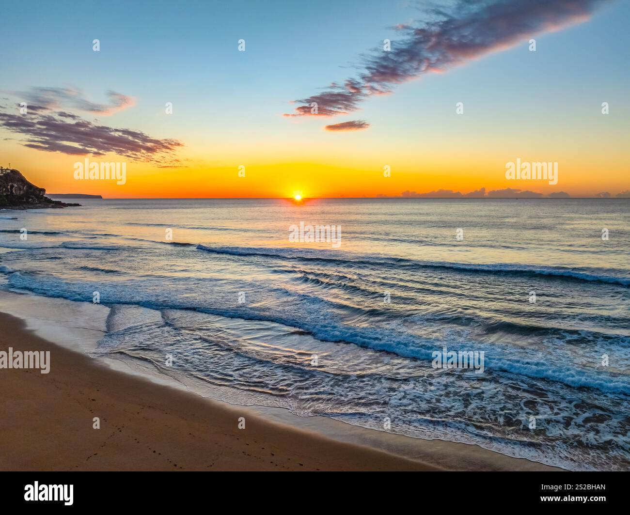 Aerial sunrise over Whale Beach in the Northern Beaches region of ...
