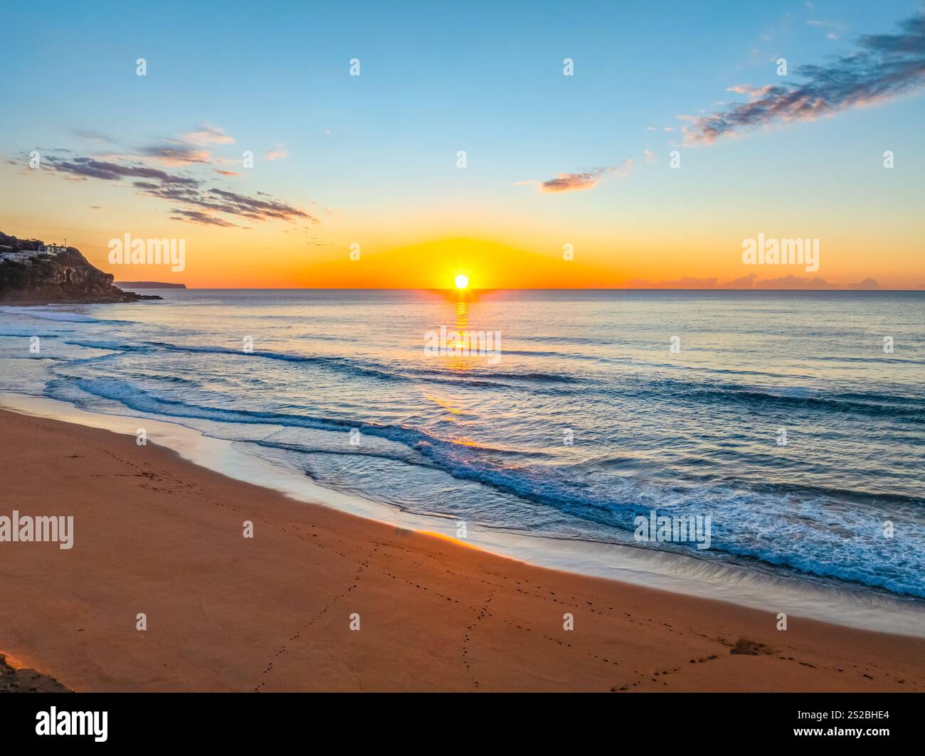 Aerial sunrise over Whale Beach in the Northern Beaches region of ...