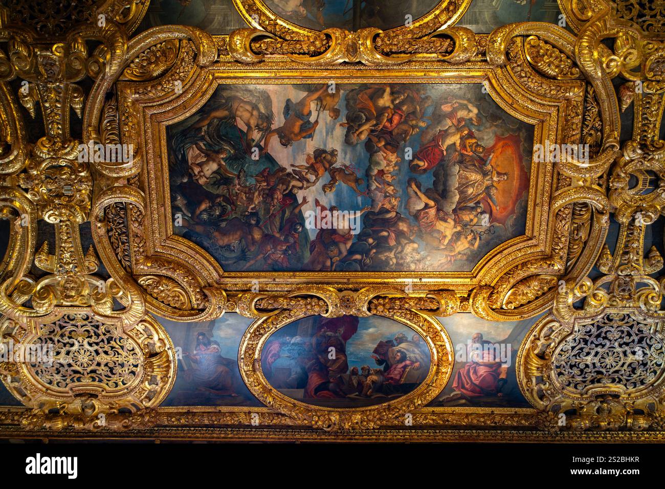 A richly decorated baroque ceiling featuring intricate gold frames ...