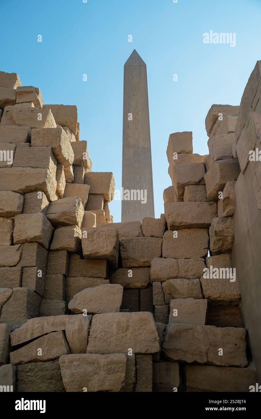 Ancient Egyptian abelisk among destroyed stone blocks Stock Photo - Alamy