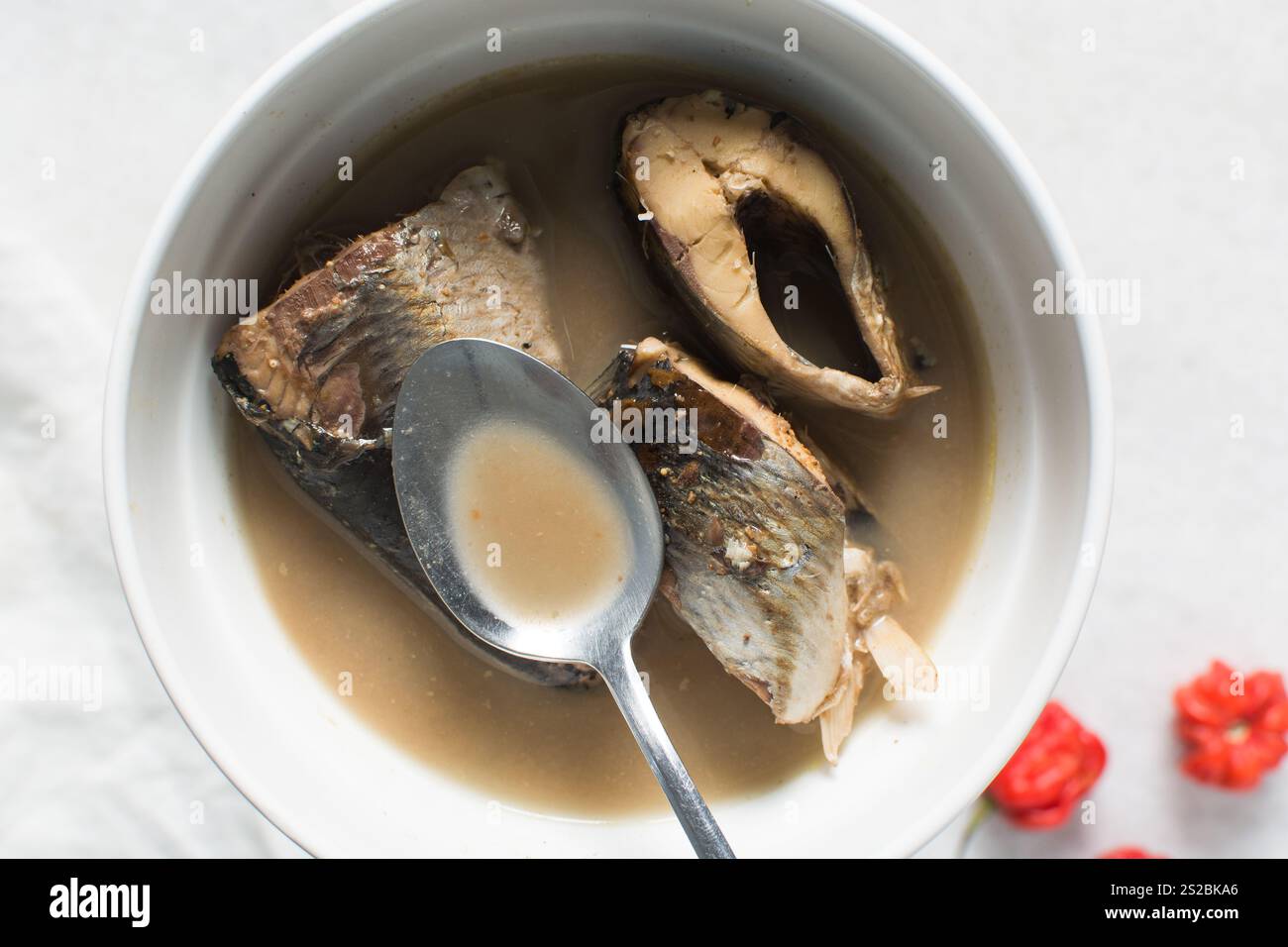 Overhead view of Nigerian pepper soup with fish, top view of fish ...